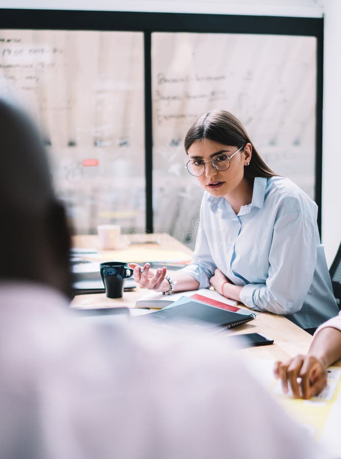 Female Worker Explaining Opinion during Business Negotiation Stock ...