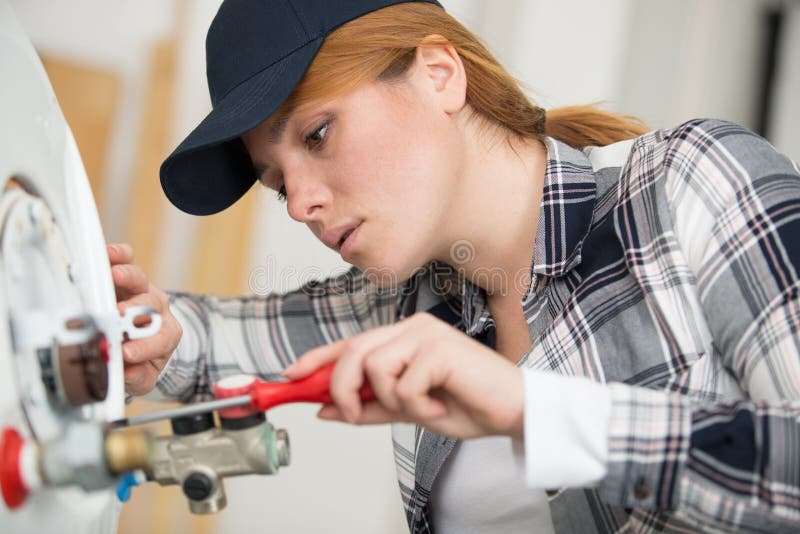 Female Worker Fixing Boiler Stock Photo - Image of female, installing ...