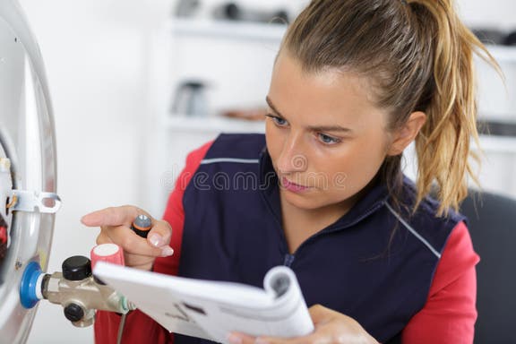 Female Worker Fixing Boiler Stock Image - Image of boile, fixing: 253358099