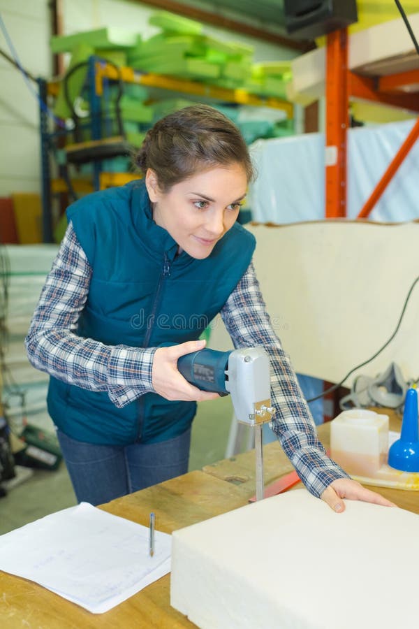 Female worker fixing chair stock image. Image of lath - 309331055