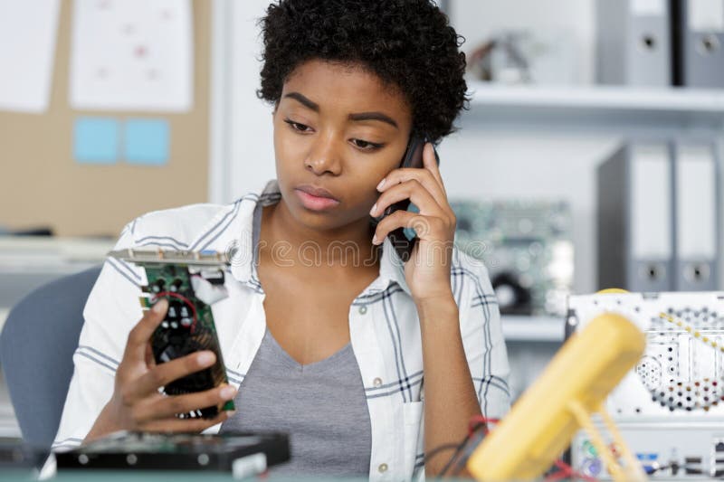 Female Worker Fixing Device in Electronics Workshop Stock Image - Image ...