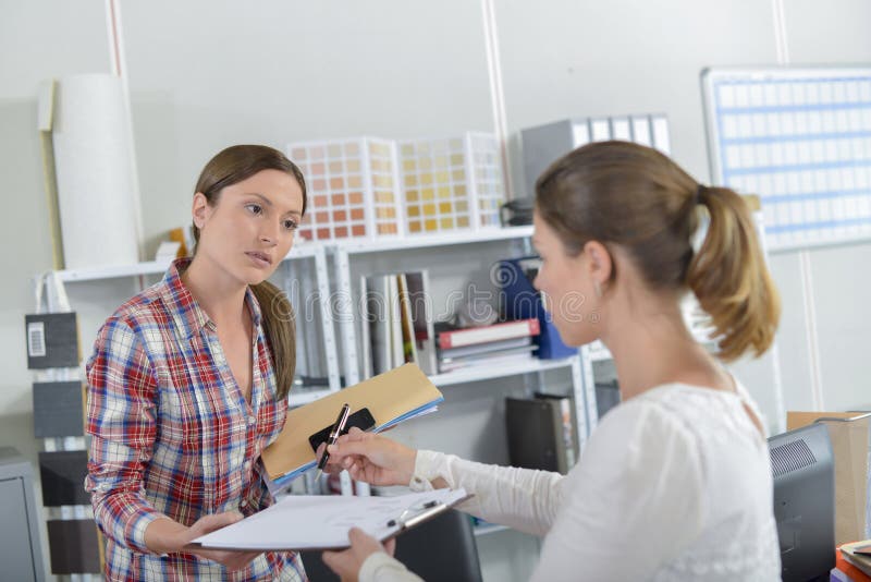 Female Worker Handing Over Document Stock Image - Image of caucasian ...