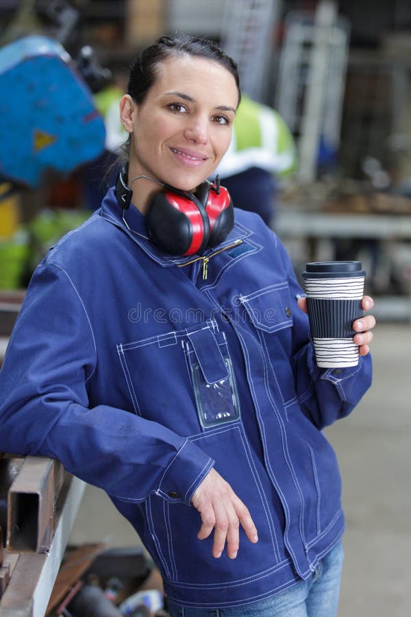 Female Worker Holding Coffee during Break in Workplace Stock Photo ...