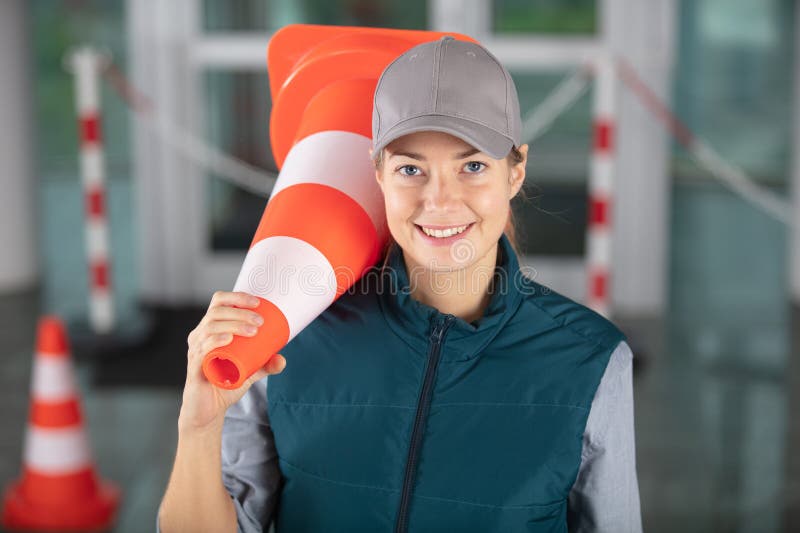 Female Worker Holding Construction Cone Stock Photo - Image of ...