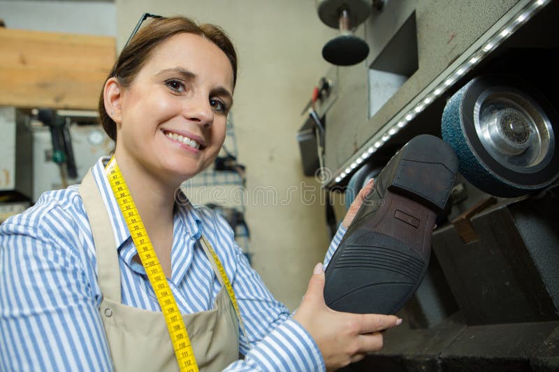Female worker making shoes stock image. Image of craft - 270026083