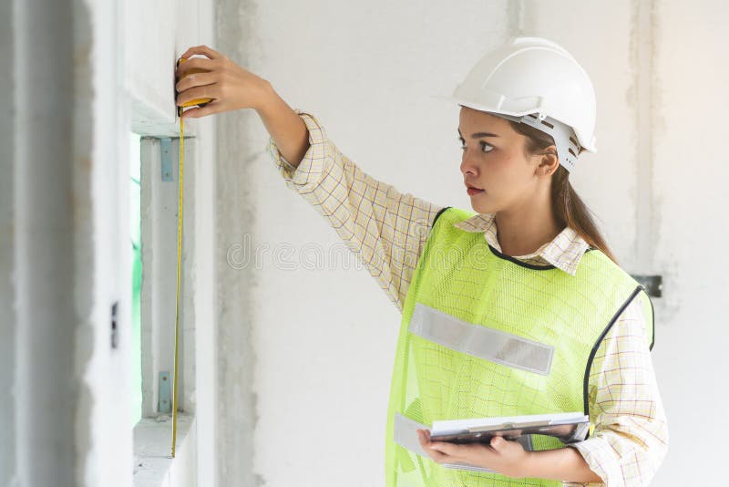 Female Worker Occupation. Woman Inspector / Architect Checking Interior ...
