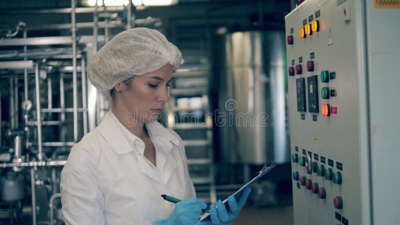 Female Worker is Operating a Control Panel in a Factory Unit Stock ...