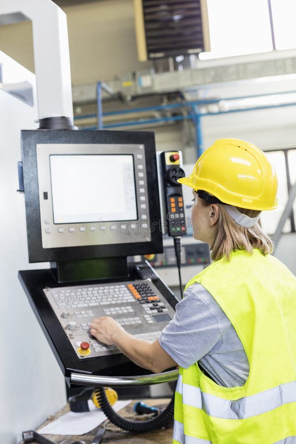 Female Worker Operating Machinery at Control Panel in Factory Stock ...