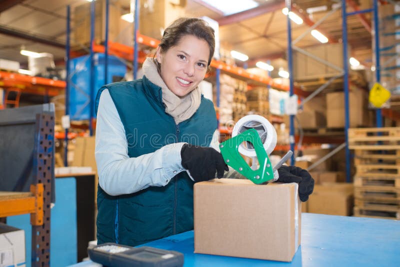 Female Worker Packing Box in Warehouse Stock Photo - Image of shelves ...