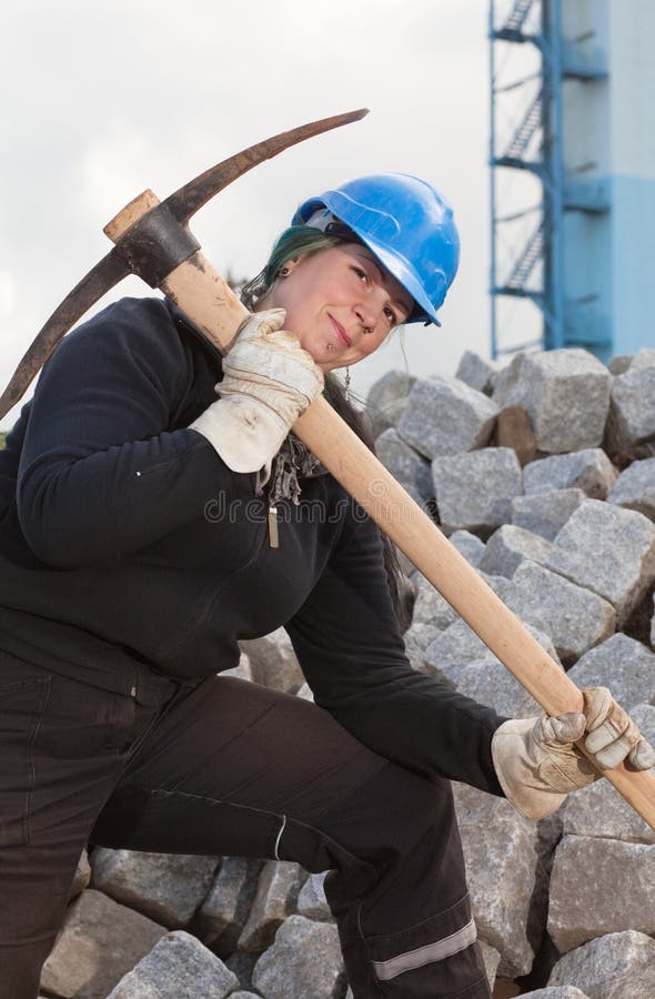 Female worker with pickaxe stock photo. Image of protective - 11655620