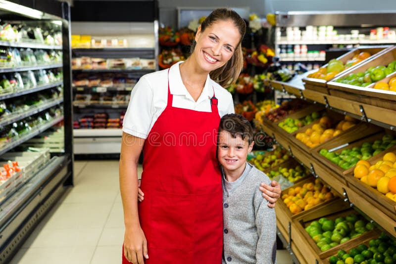 Female Worker Posing with Little Boy Stock Photo - Image of leisure ...