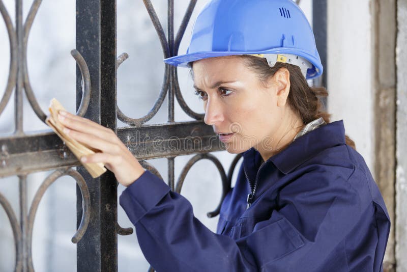 Female Worker Sanding Frame Stock Photo - Image of plasterwork, hands ...