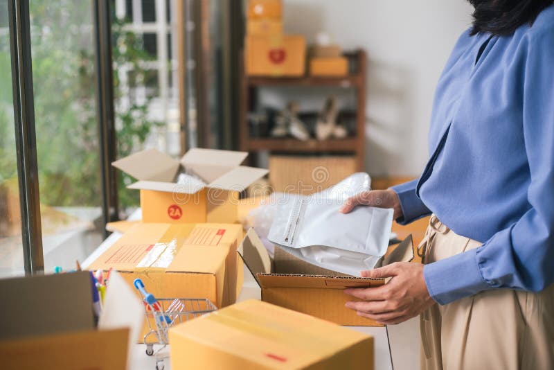 Female Worker or Seller Packing Roasted Coffee Beans in Packaging ...