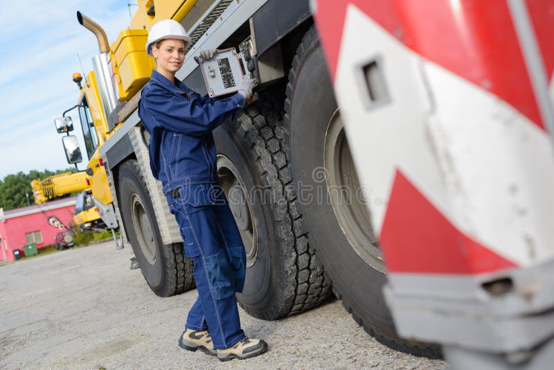 Female Worker by Side Lorry Stock Photo - Image of overalls, standing ...