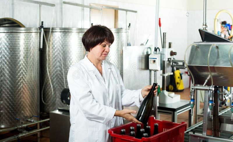 Female Worker Sorting Wine Bottles Stock Photo - Image of caucasian ...