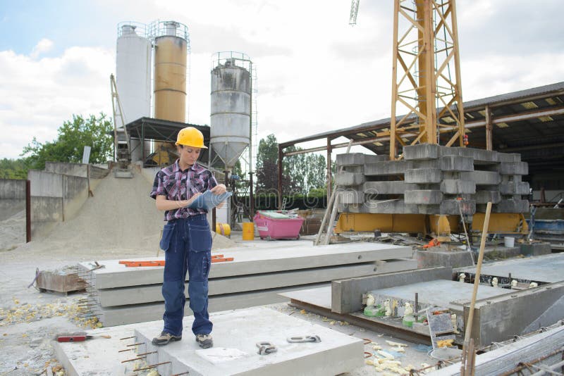 Female Worker Stood on Concrete Pad on Construction Site Stock Photo ...