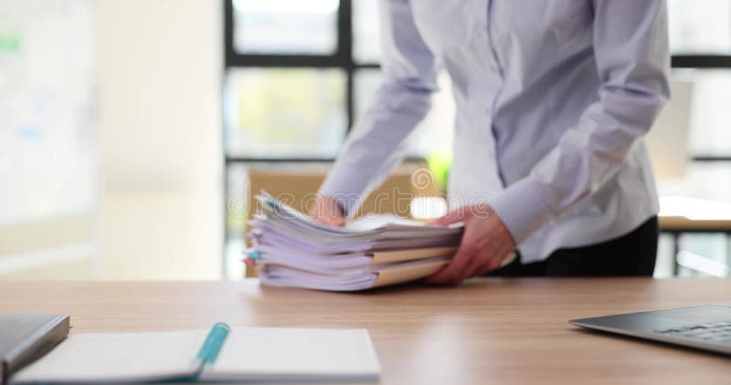 Female Worker Takes Stack of Task Folders Away from Table Stock Footage ...