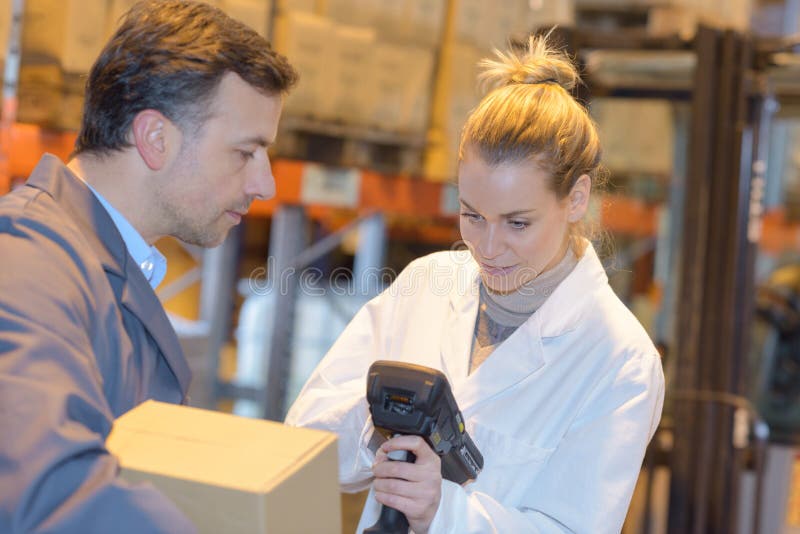 Female Worker Using Barcode Scanner Stock Photo - Image of information ...