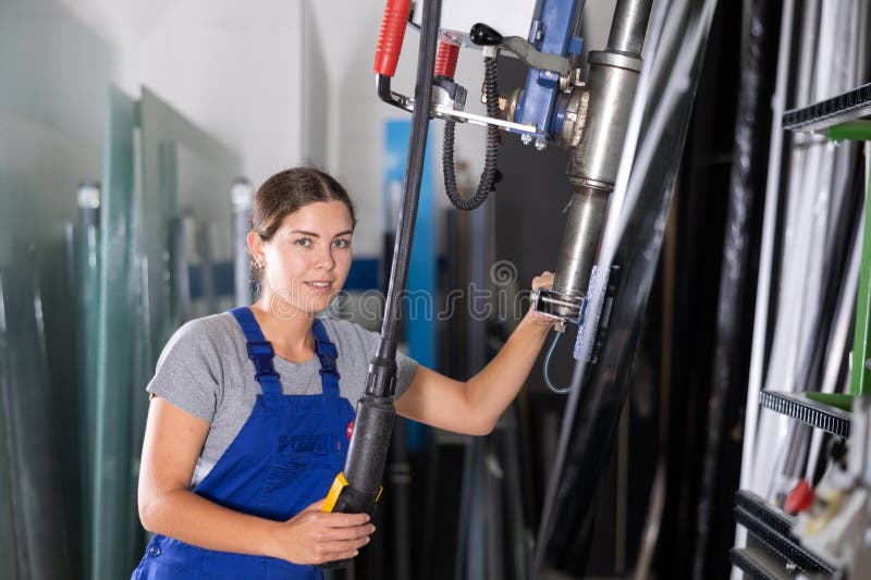 Female Worker Using Control Panel and Lifting Mechanism Controls ...