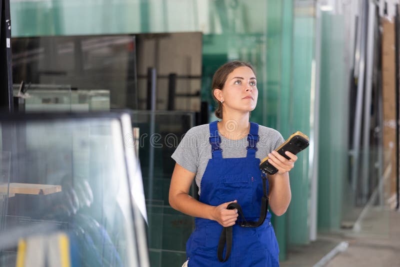 Female Worker Using Control Panel and Lifting Mechanism Controls ...