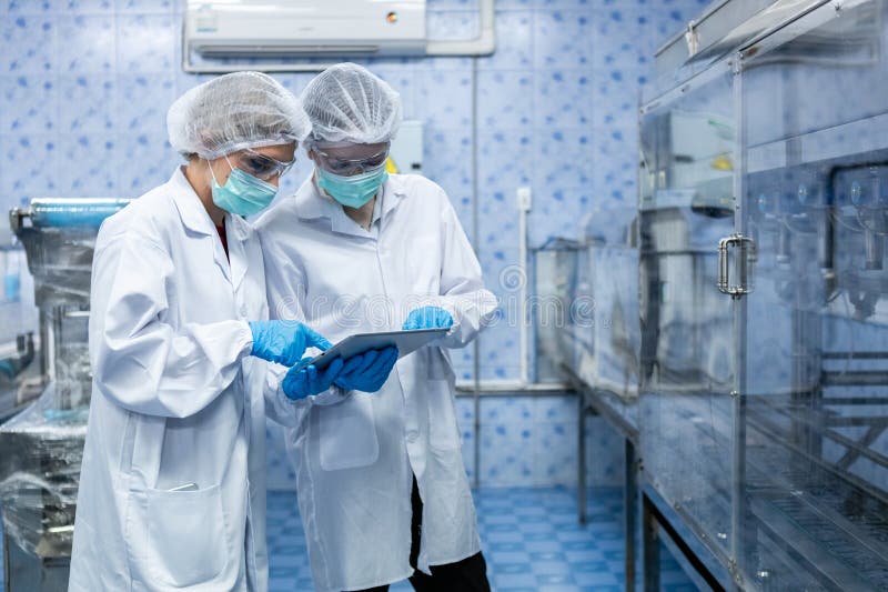 Female Worker Using Tablet Checking Quality Drinking Water before ...