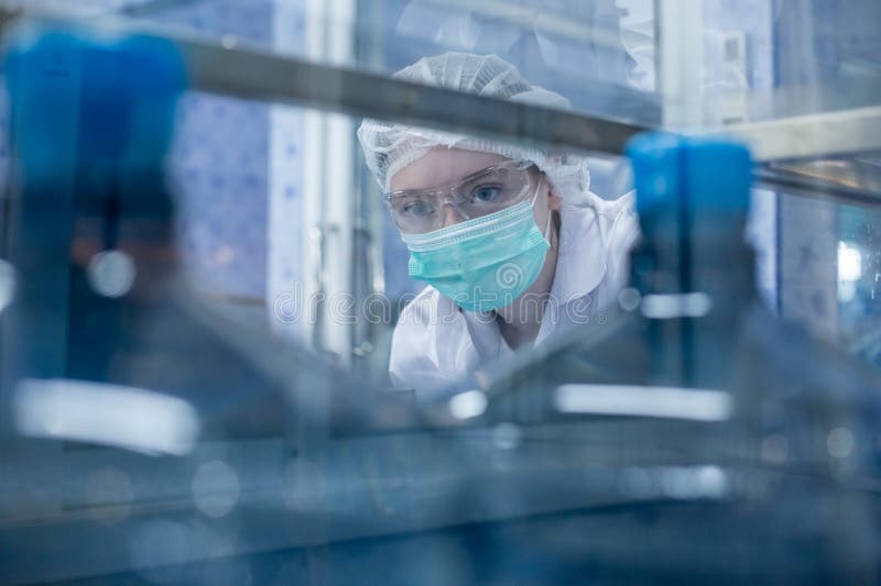Female Worker Using Tablet Checking Quality Drinking Water before ...