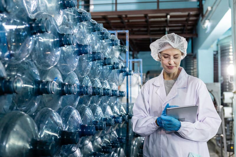 Female Worker Using Tablet Checking Quality of Large Drinking Water ...
