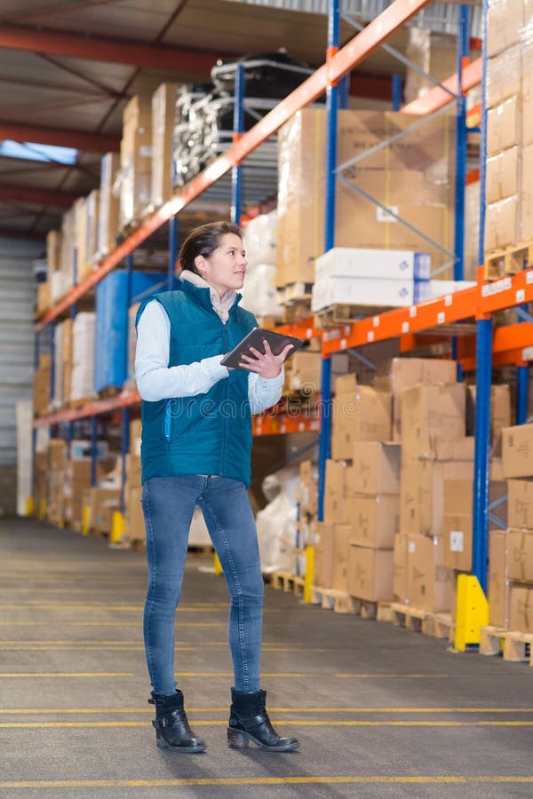Female Worker Using Tablet in Warehouse Stock Photo - Image of ...