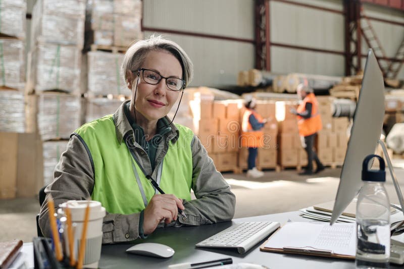 Female Worker Working on Computer in Warehouse Stock Photo - Image of ...