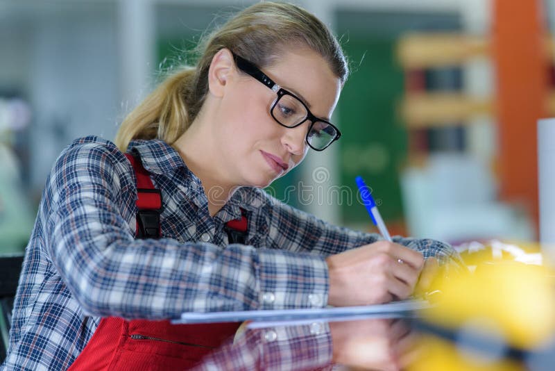 Female Worker Writing Something Stock Image - Image of worker ...