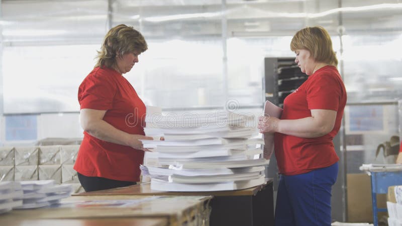 Female Workers Sorting a Paper Stacks in the Typography Stock Image ...