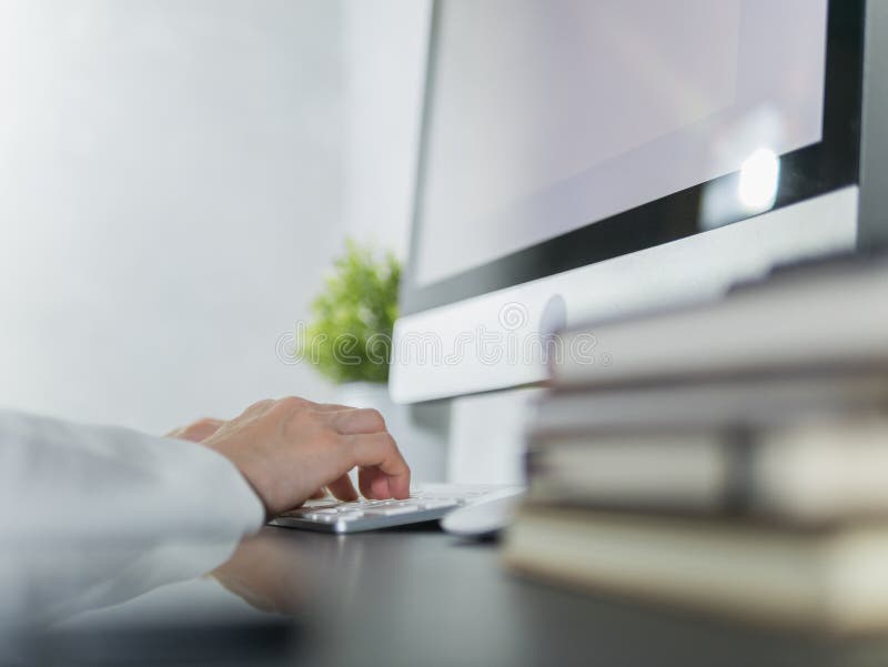 Female Working on Computer Typing on Keyboard Sitting at Office Desk ...