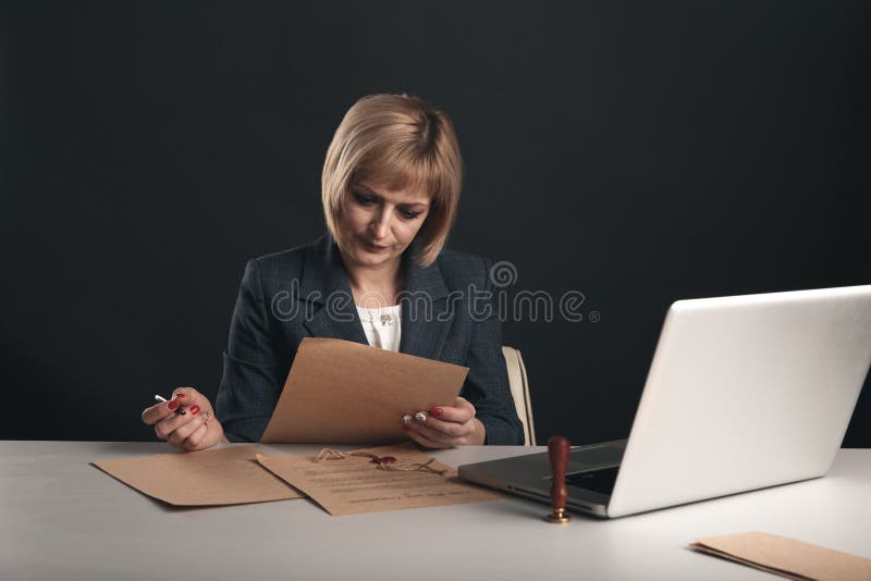 Female Working at the Desk with Paper Documents. Attorney Concept ...