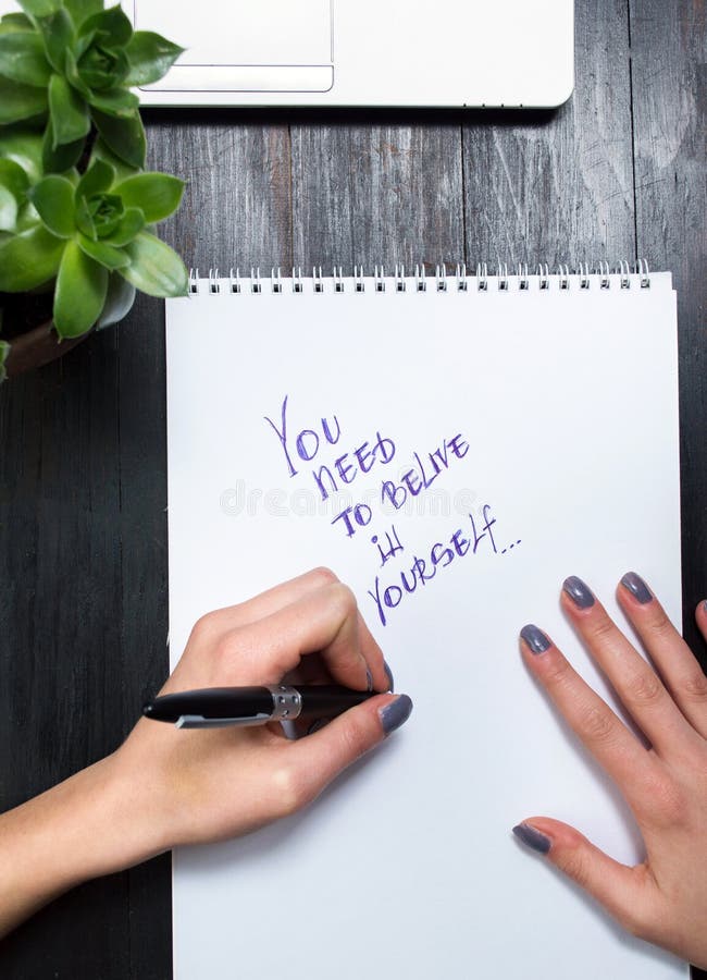 Female Writing Motivational Message in a Notebook Stock Image - Image ...
