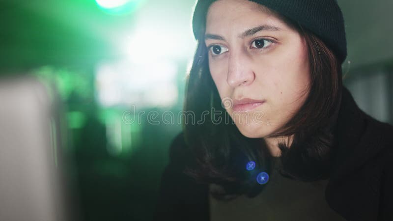 Female Young Hacker Working On Computer In Dark Room Programming Code