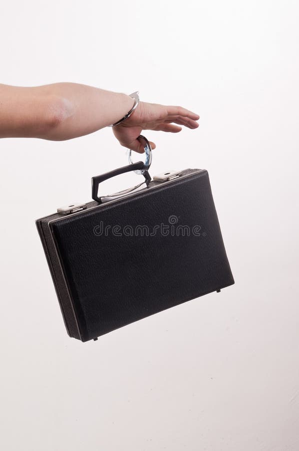 Females Hand with Handcuff and a Suitcase Stock Photo - Image of ...