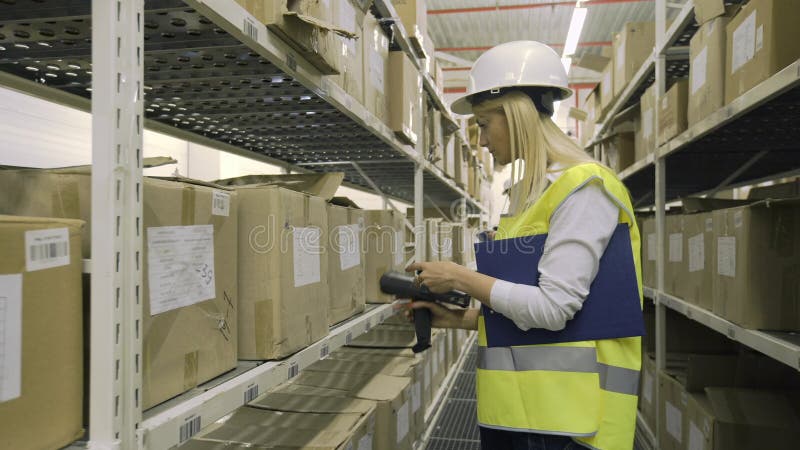 Femalr Warehouse Worker Checking Cargo on Shelves Stock Video - Video ...