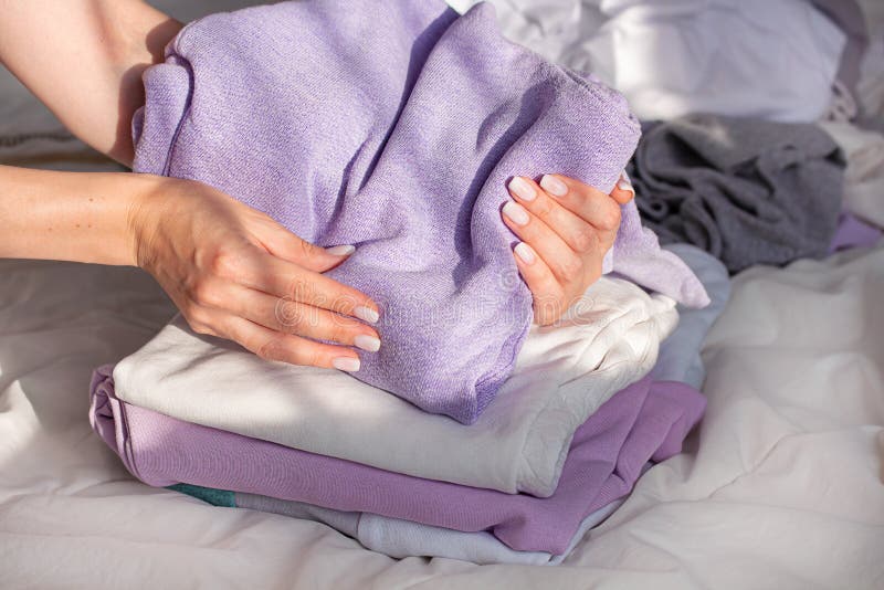 Feminine Hands Getting Clothes into the Shape of a Small Rectangle ...