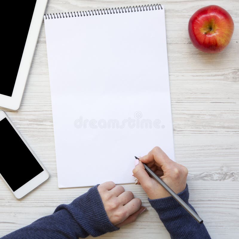 Feminine Workspace with Smartphone, Tablet, Notebook and Apple ...