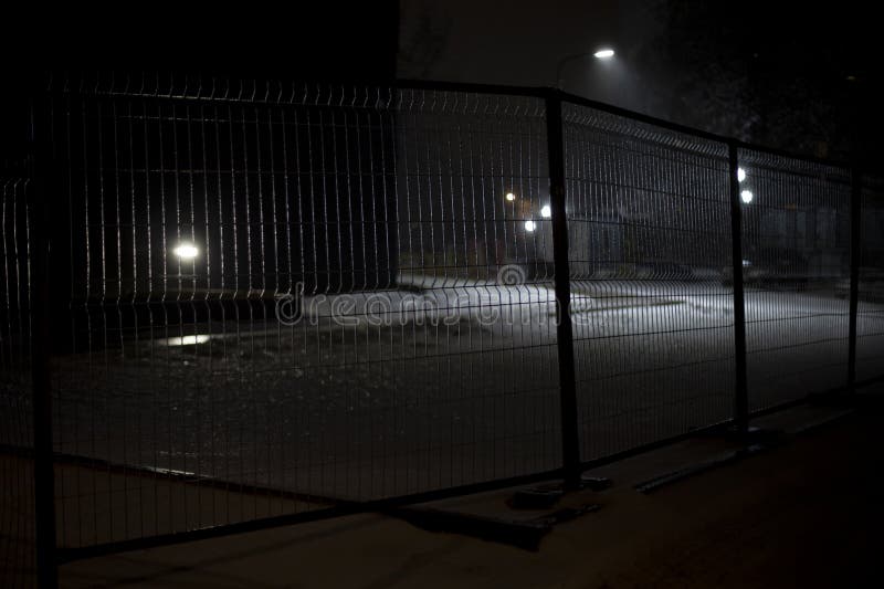 Fence Around the Parking Lot at Night. Territory at Night Stock Photo ...