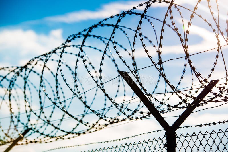 Security Fence with Barbed Wire Stock Photo - Image of penitentiary ...