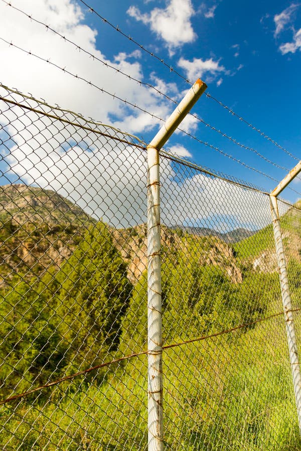 Fence with Barbed Wire in the Open Air Stock Photo - Image of metal ...