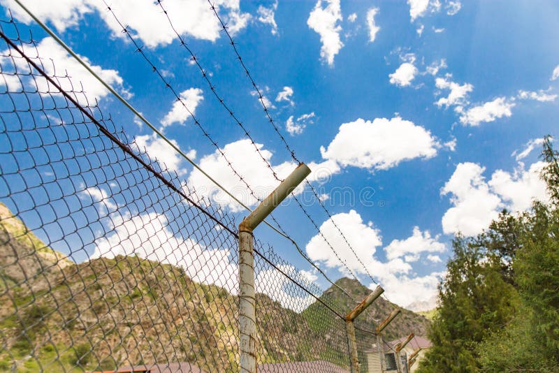 Fence with Barbed Wire in the Open Air Stock Image - Image of barrier ...