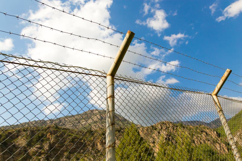 Fence with Barbed Wire in the Open Air Stock Image - Image of guard ...