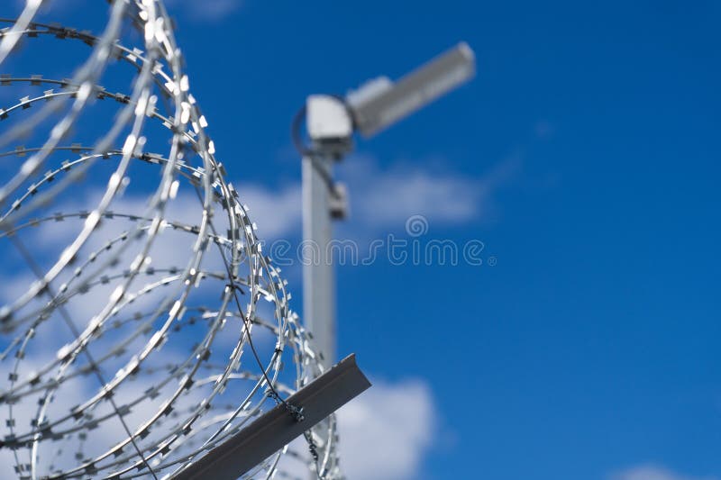 Fence with Barbed Wire. Barbed Wire Security Fence Stock Image - Image ...