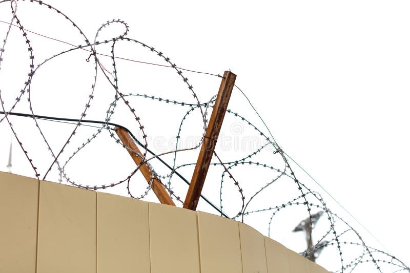 A Fence with Barbed Wire on Top of it Stock Photo - Image of safety ...