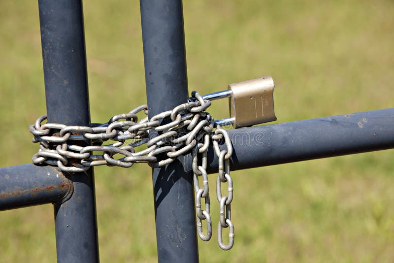 Fence with chain and lock stock image. Image of trees - 16735309