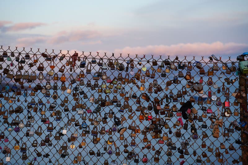 A Fence Covered in Lots of Locks and Keys of Different Shapes and Sizes ...