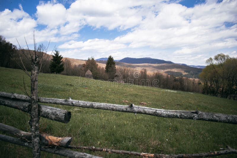 Fence and Field on the Background of Mountains Stock Image - Image of ...