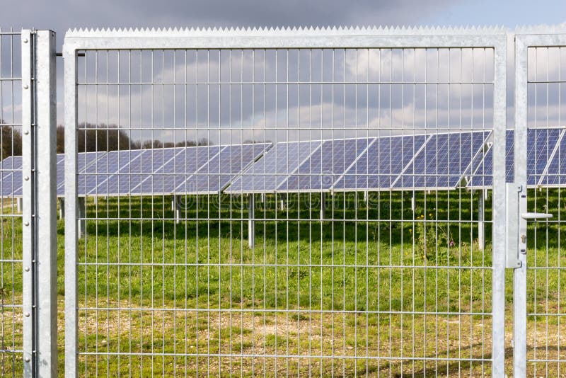 Fence in Front of Solar Array Stock Image - Image of green, array ...
